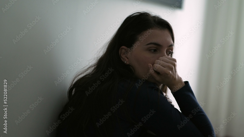 Person suffering from emotional pain leaning on wall sitting on floor ...