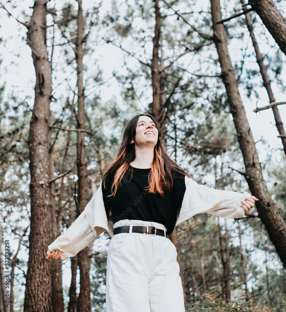 young woman breathing clean air in nature forest.Fresh outdoor ...