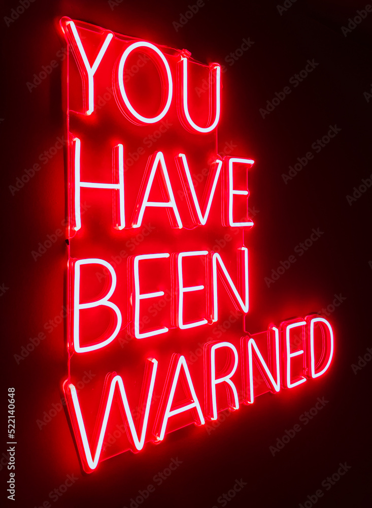 Red neon sign on dark background Stock Photo | Adobe Stock