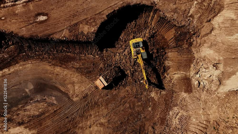 Excavator during clay mining. mining in open pit. Aerial view of an ...
