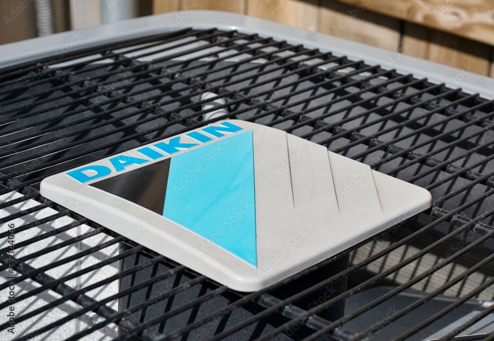 Daikin air conditioner unit, overhead close angled view of brand logo ...