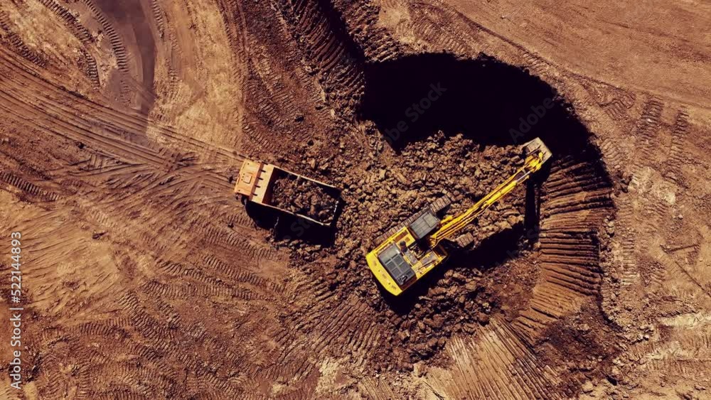 Excavator during clay mining. mining in open pit. Aerial view of an ...