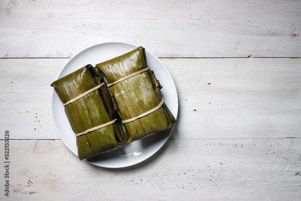 Buras or Burasa, is rice dumpling cooked in coconut milk wrapped in ...