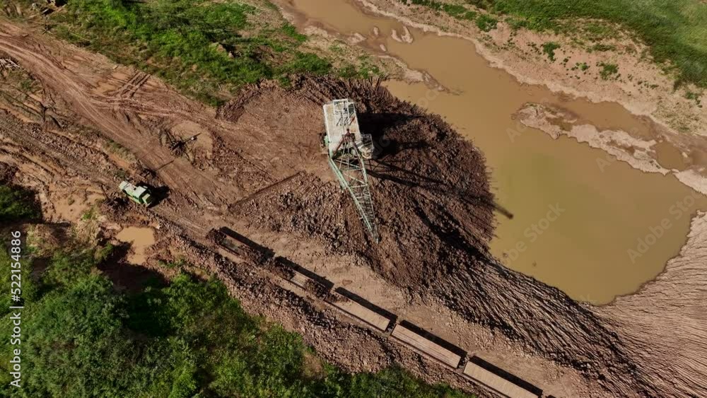 Open-pit mining. Dragline excavator load clay in freight train. Clay ...