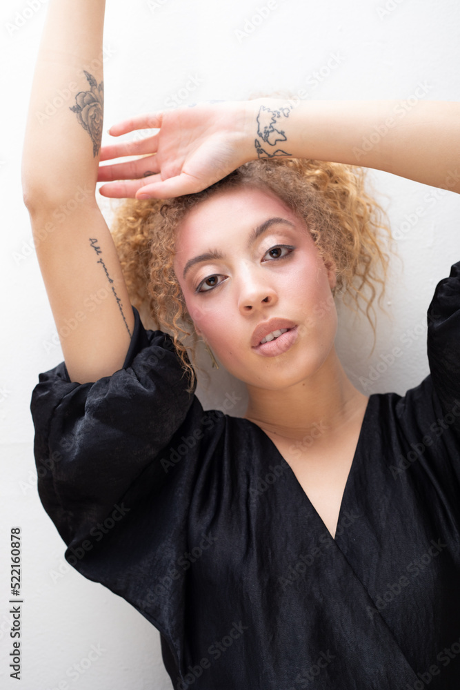 Artsy portrait of pretty Gen Z woman in black blouse, white background ...