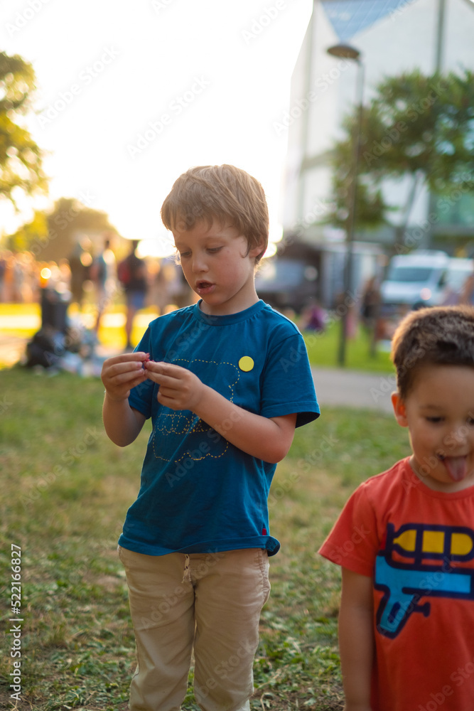 Portraits of kids playing outdoors, creating, exploring Stock Photo ...
