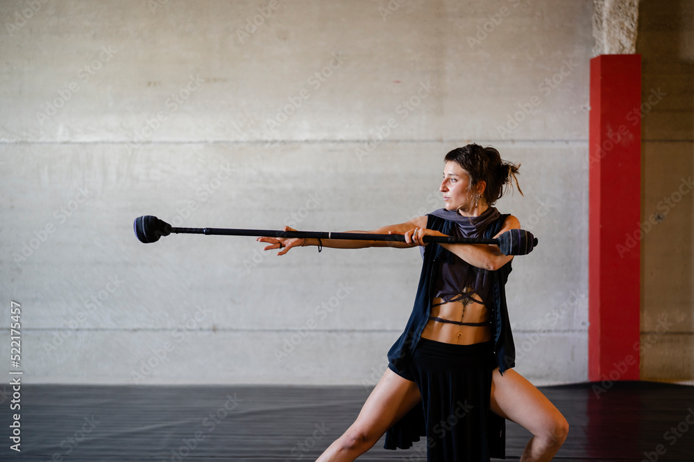 juggler with a fire baton Stock Photo | Adobe Stock