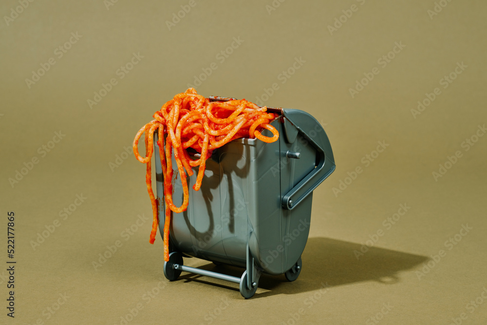 cooked spaghetti in a waste container Stock Photo | Adobe Stock