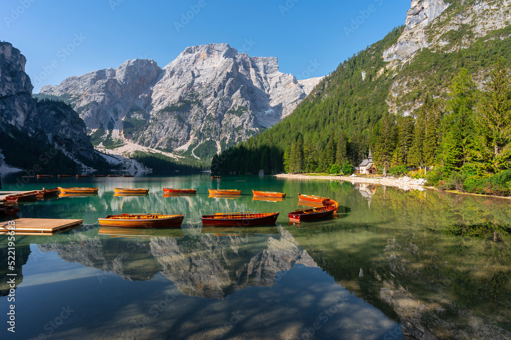 Amazing Sunrise view of Lago di Braies (Pragser Wildsee) with Wooden ...