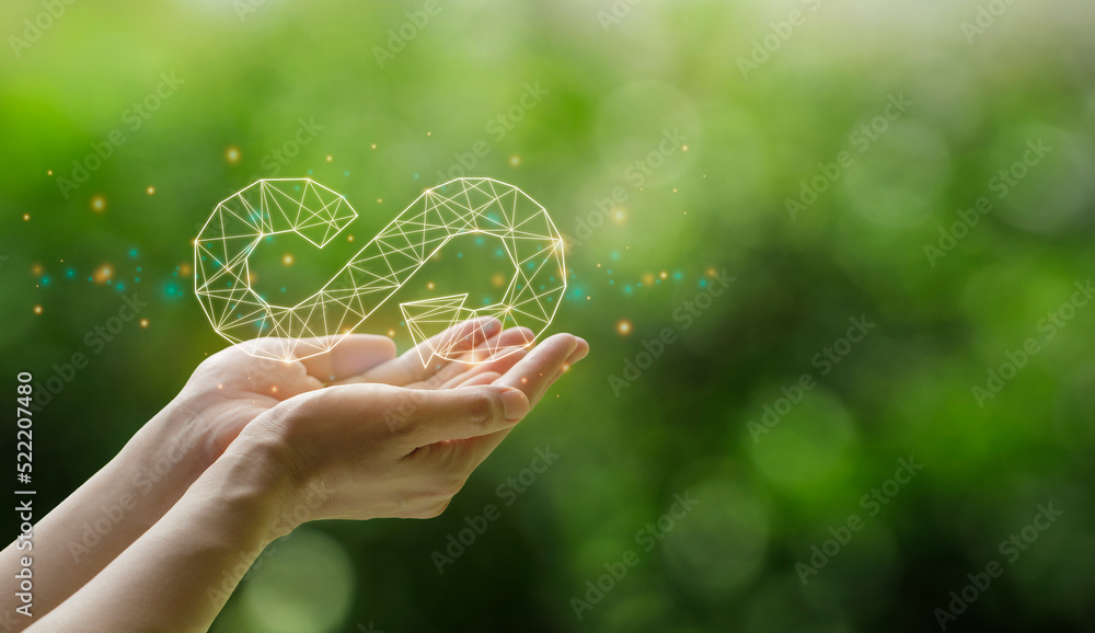 Circular economy concept. Hands hold circular economy icon on a green ...
