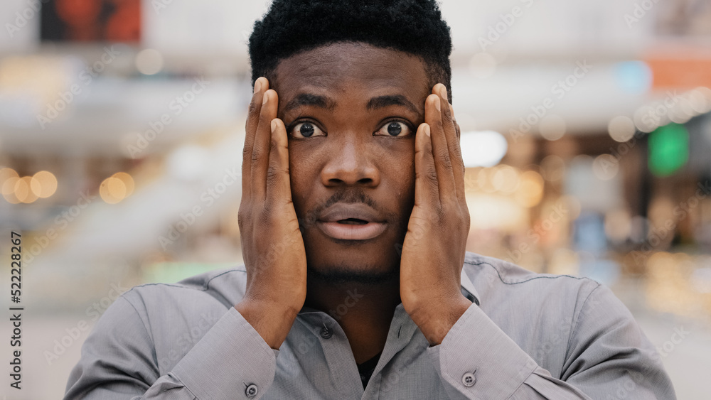 Close-up male portrait young surprised stunned excited shocked serious ...