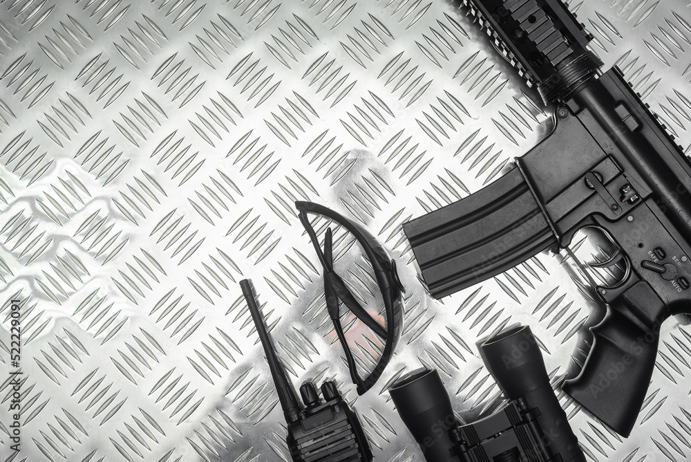 Airsoft gun and other equipment on the flat lay table background with ...