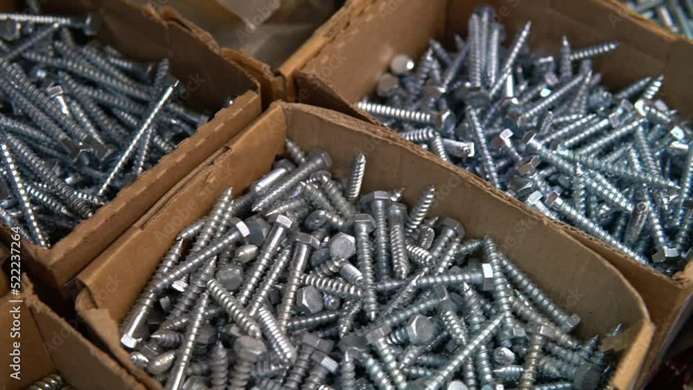 Steel, metal bolt screws fasteners. Stack of different fixing nuts in ...