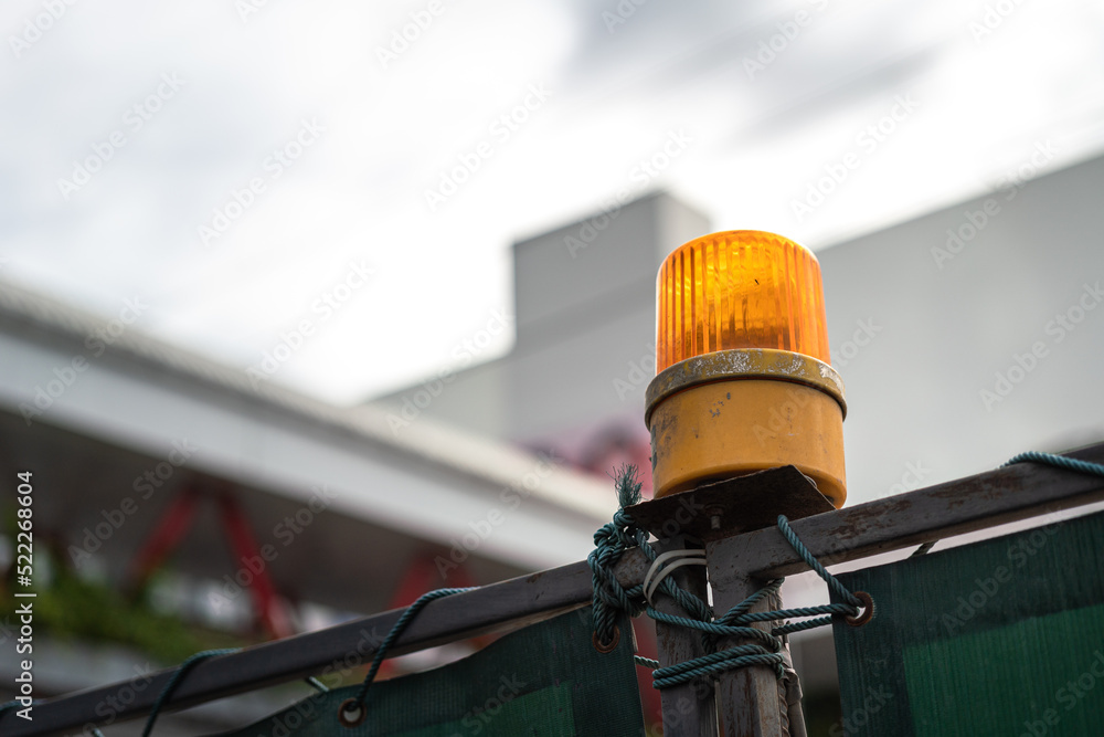 Flashing light, signal for road construction working area with city ...