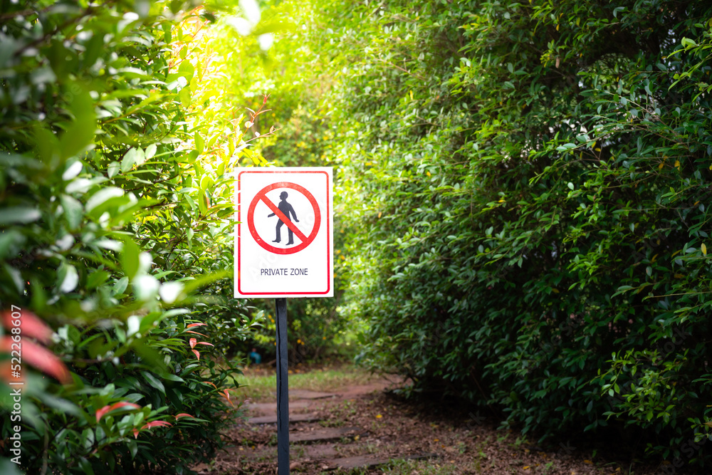 "Private zone" sign and symbol with human walking icon, placed in front ...