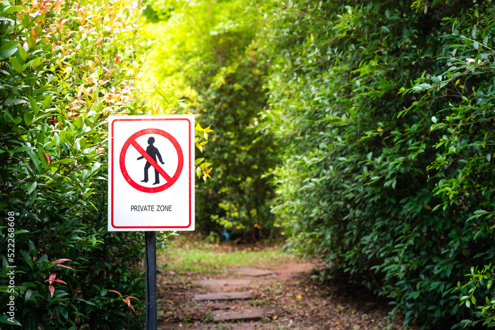 "Private zone" sign and symbol with human walking icon, placed in front ...