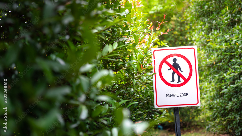 "Private zone" sign and symbol with human walking icon, placed in front ...