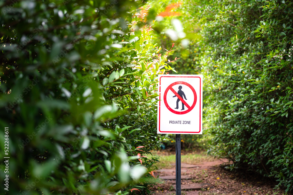 "Private zone" sign and symbol with human walking icon, placed in front ...
