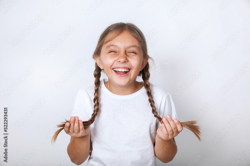 Portrait of nice funny cheerful positive pre-teen girl wearing white t ...