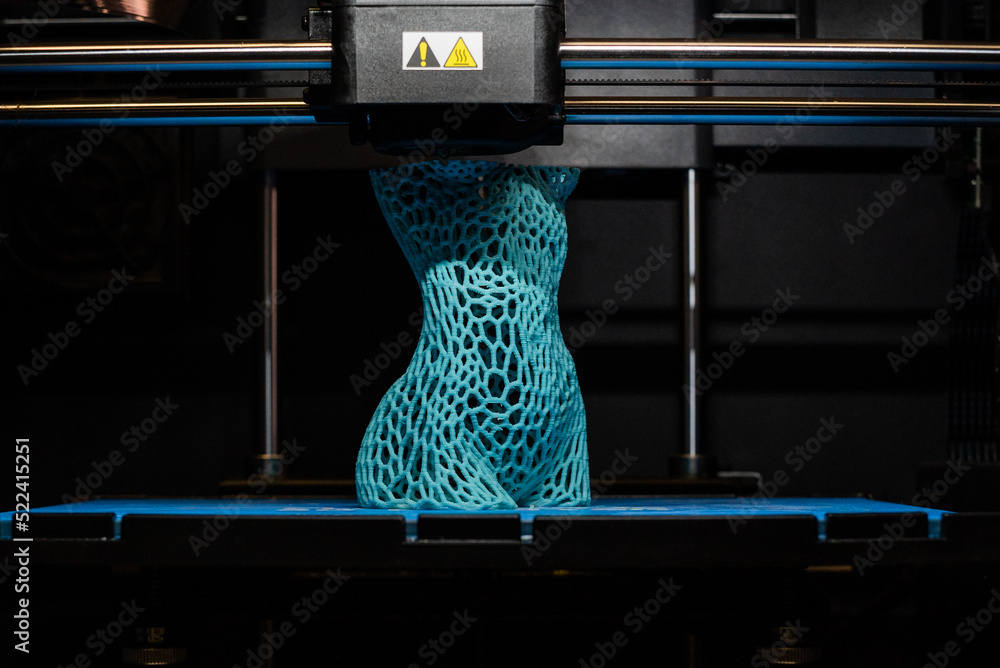 3d printer prints the model of female body, process of creating a bust ...