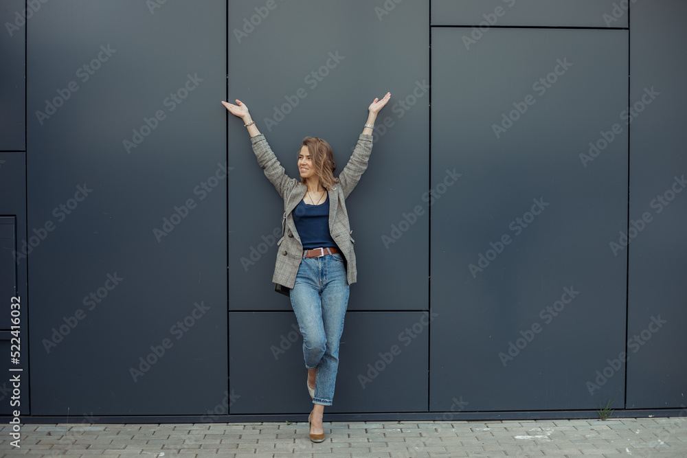 Full length photo of happy young businesswoman standing on one leg ...