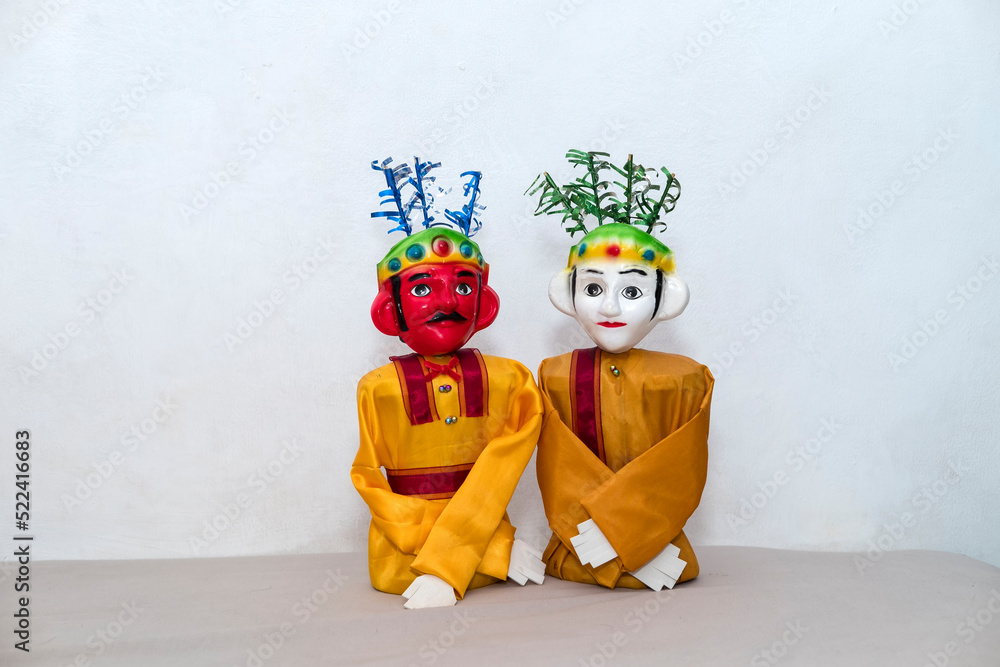 Miniature ondel ondel puppet figure at white isolated background. Ondel-ondel is a large puppet ...