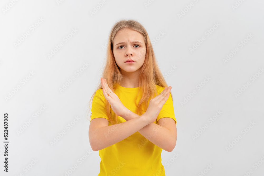 Stop. Upset teen girl shows stop, cross hands gesture, rejecting ...