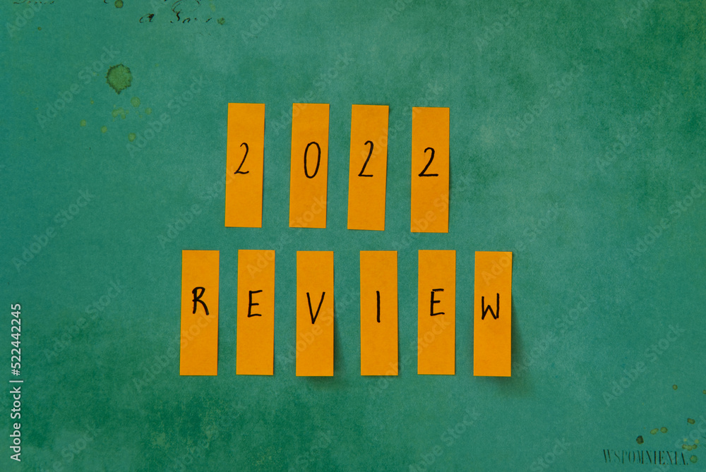 2022 review. Paper post it notes with 2022 sumary written. Concept ...