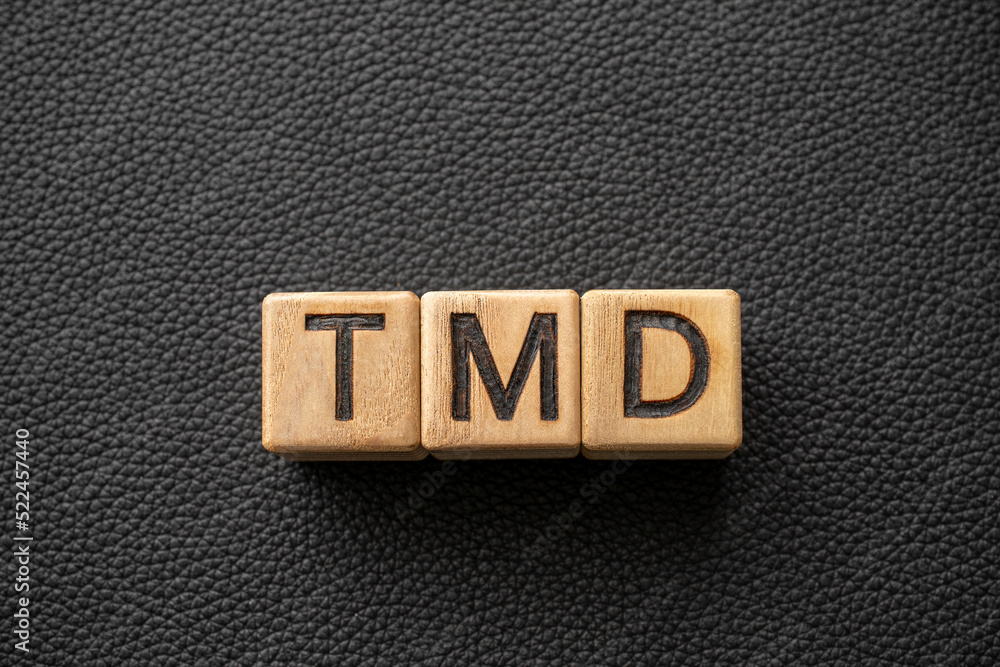 TMD - acronym from wooden blocks with letters, abbreviation TMJ ...
