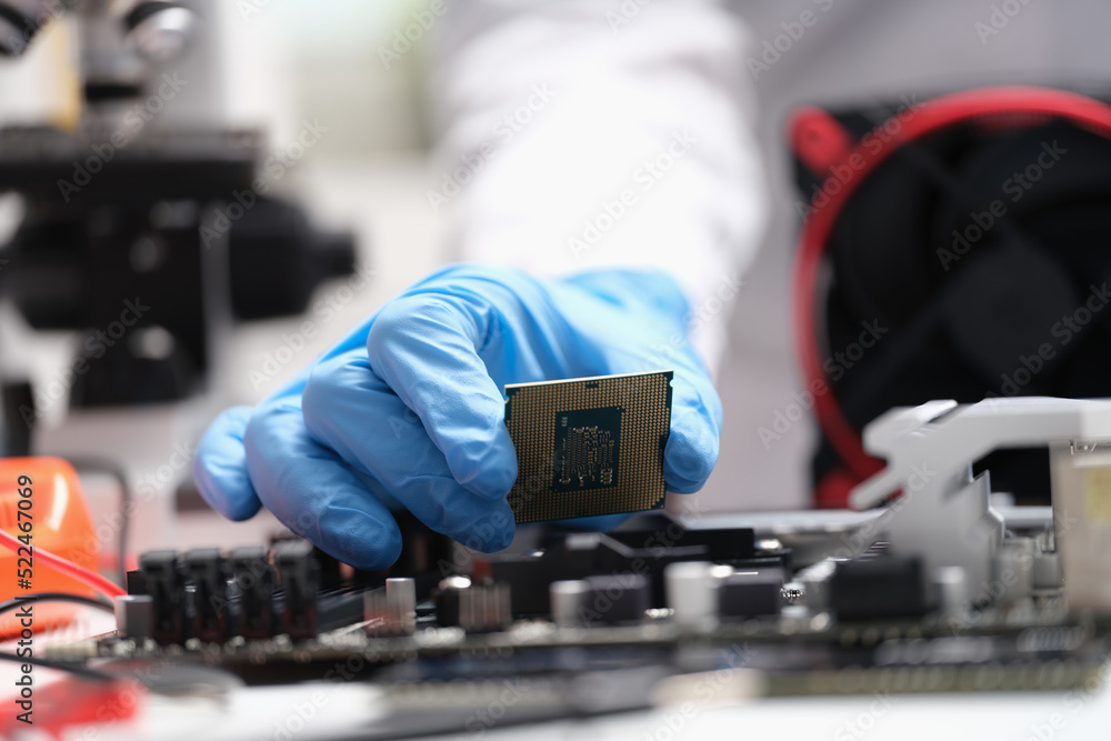 Installing modern central processor unit into motherboard Stock Photo | Adobe Stock