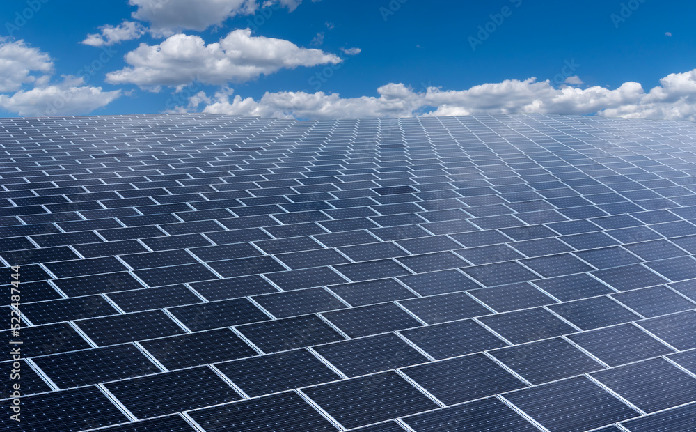Vast surface of Solar Panels on blue sky with white clouds ...