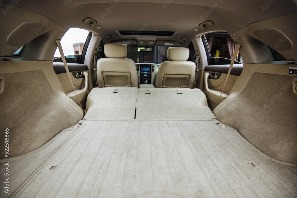 Luxury car boot with folded seats. Opened empty car trunk. Clean trunk ...