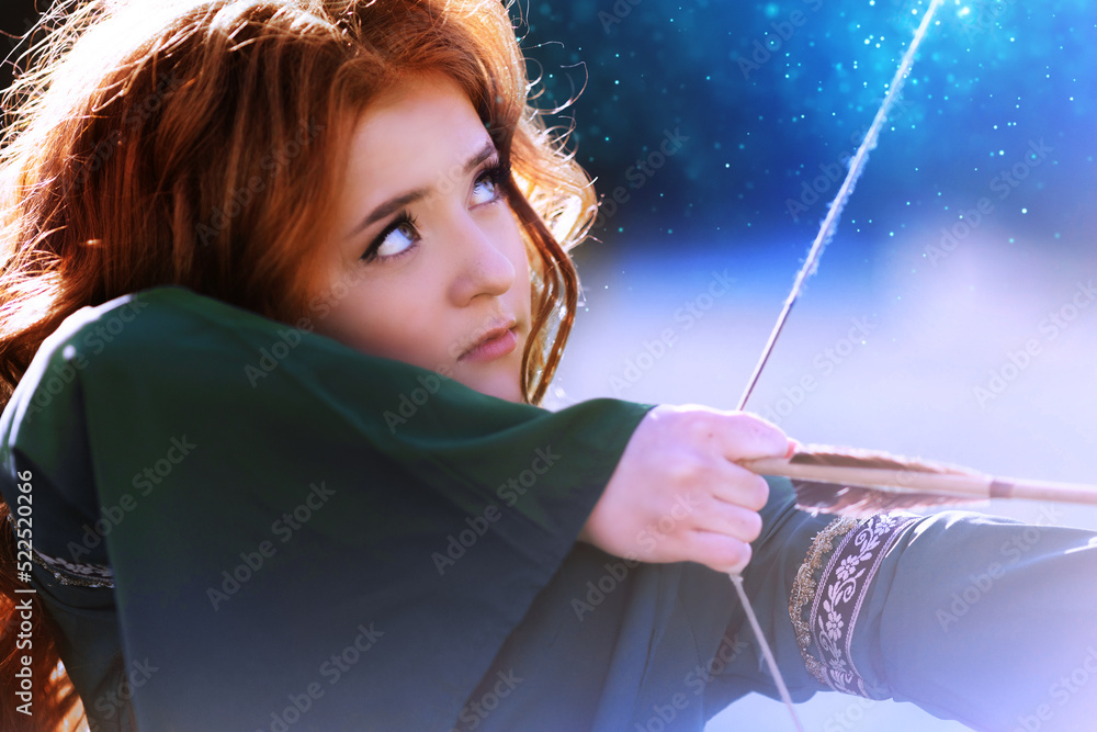 mysterious red-haired warrior girl stands. Lady elven princess holds ...