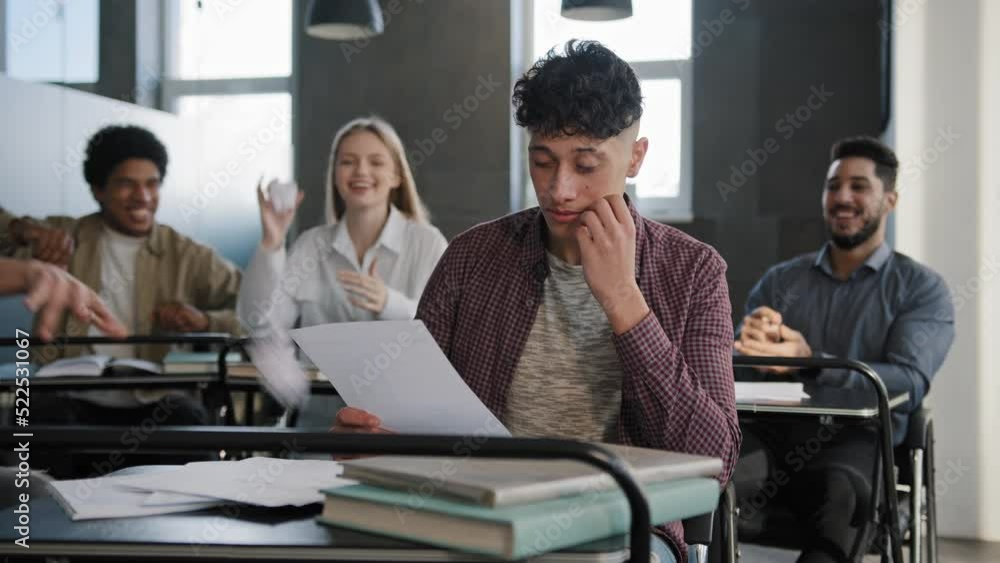 Sad upset abused depressed student sits in classroom at desk alone ...