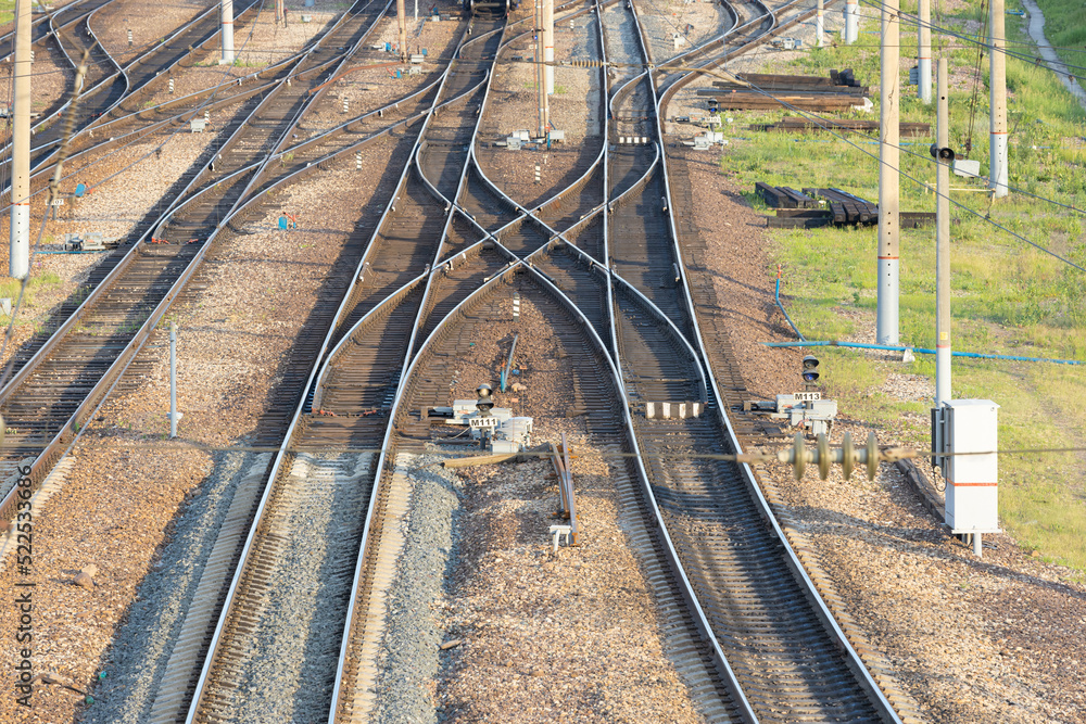 A railway junction with crossing parallel railroad tracks. Perspective ...