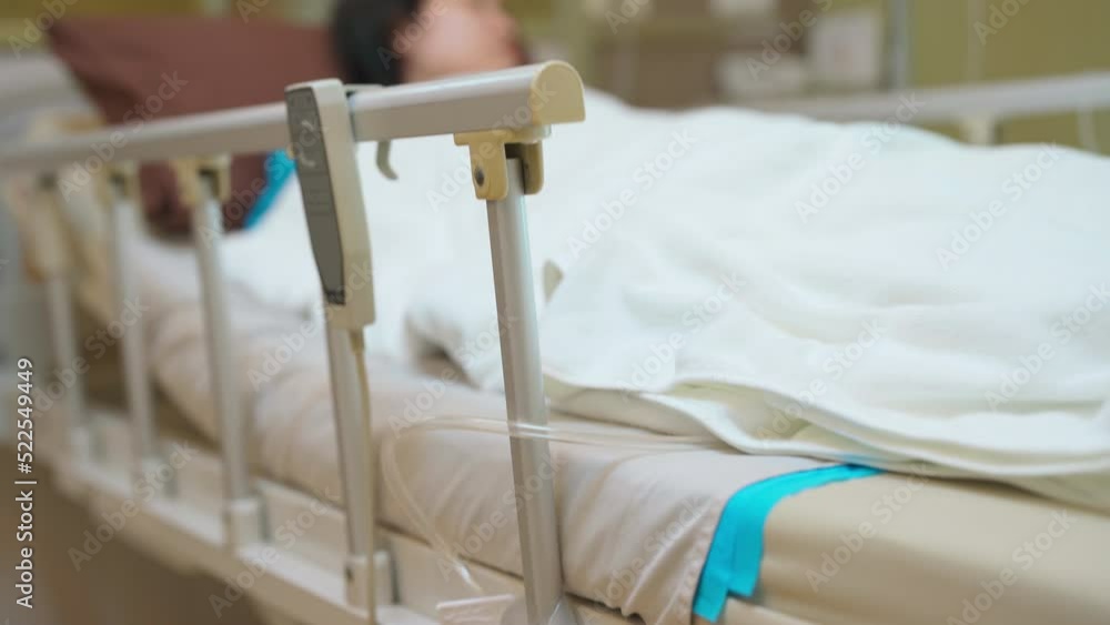 Asia patient woman lying on the bed using plastic urine collection bag ...