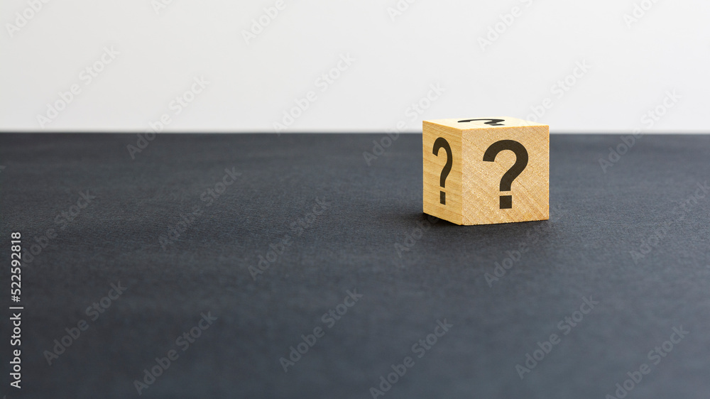 wooden block with question marks on black background, business teamwork ...