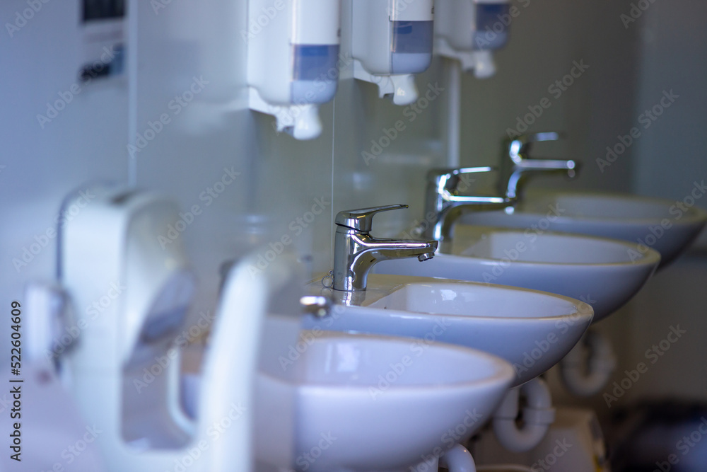 Washing basins in public toilet Stock Photo | Adobe Stock