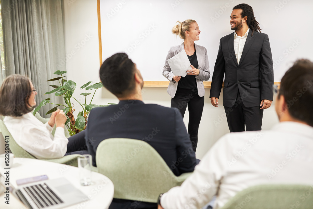 Two business people and participants in the coaching seminar Stock ...