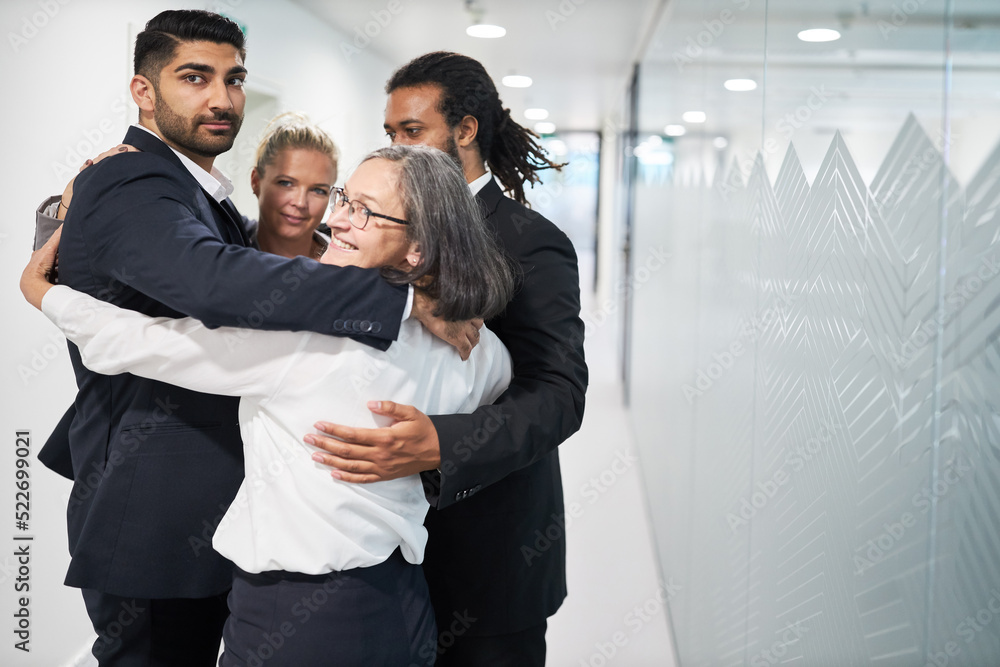 Multicultural business team hugging in a circle Stock Photo | Adobe Stock