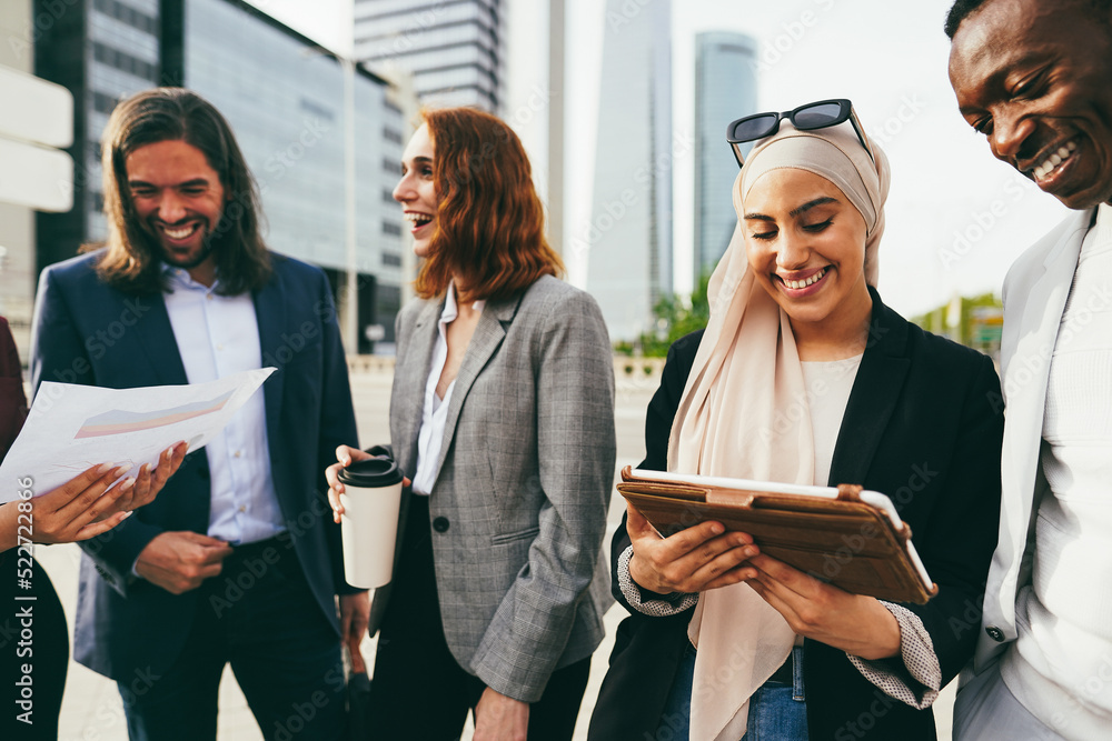 Multiracial business people working outdoor from office building ... Multiracial business people working outdoor from office building ...
