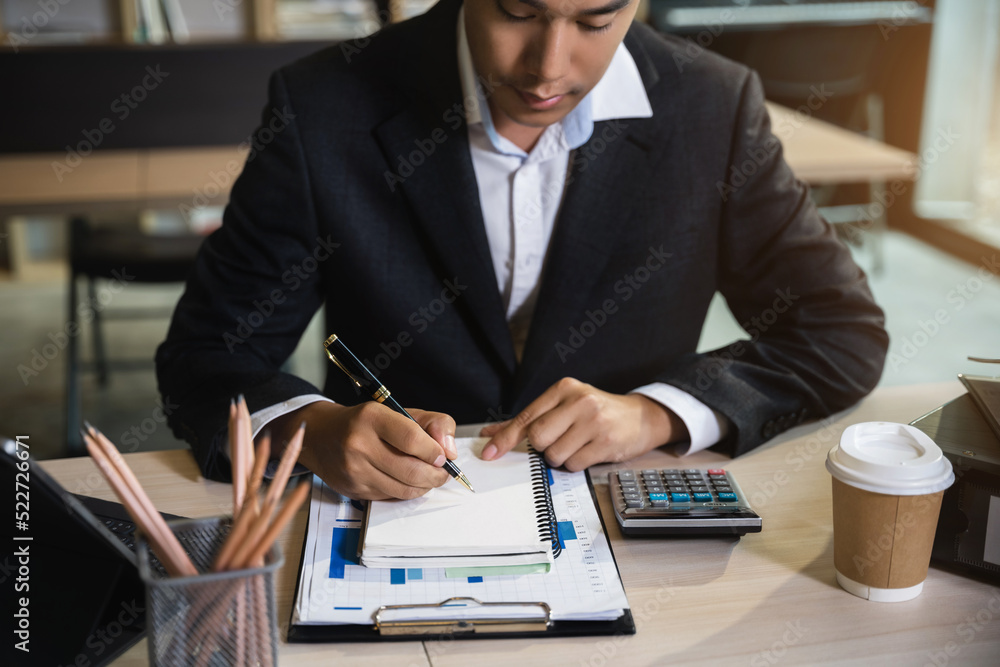 Male hand taking notes on a notebook handwritten note writing business ...