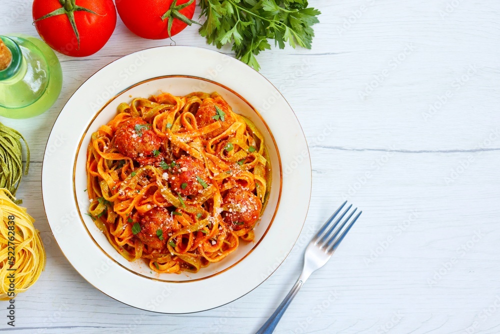 Italian Traditional Dish"Paglia e fieno con polpettine",spinach and ...