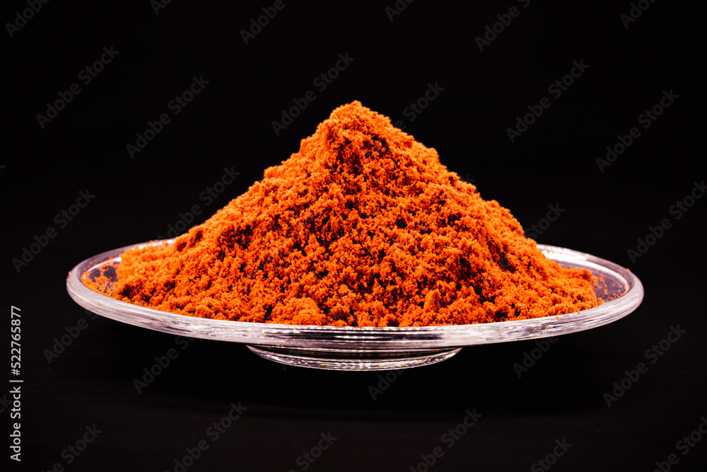 red pigment powder, blood red, with black background, industrial use in ...