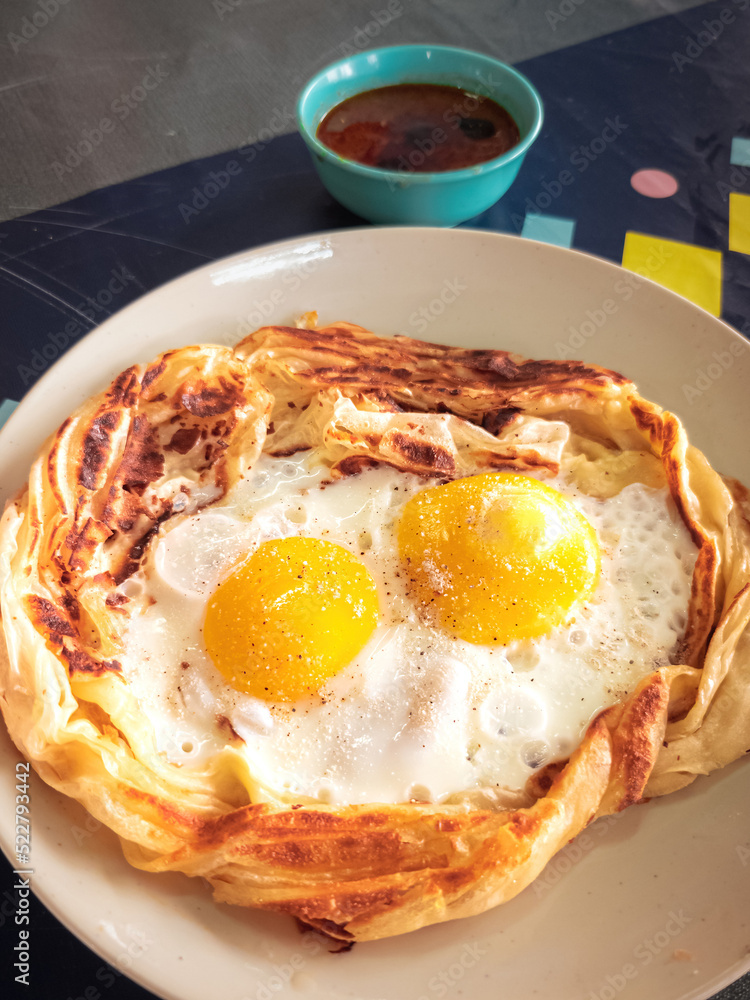 "roti sarang burung" on the table. It is pratha looks like bird nest ...
