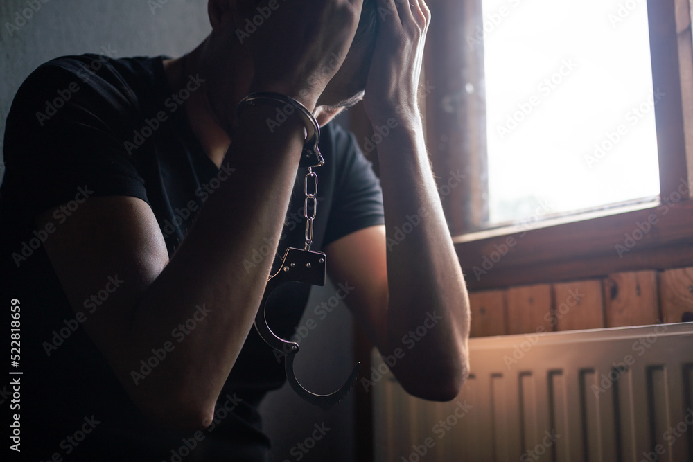 prisoner concept, Handcuffed hands of a prisoner in prison, Male ...