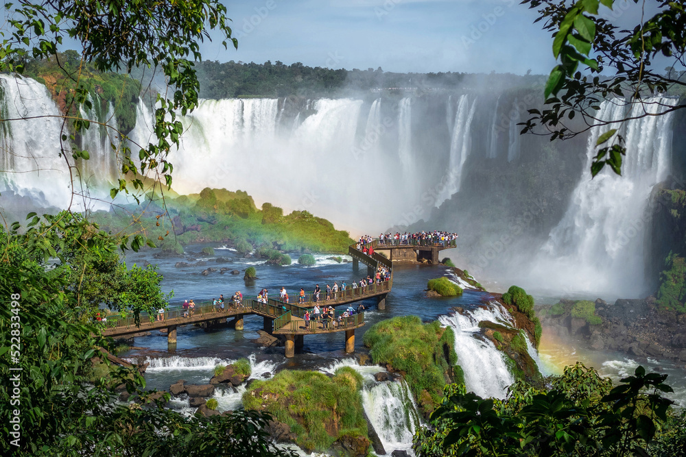 Tourists exploring the Brazilian side of Iguazu Falls in Foz do Iguacu ...