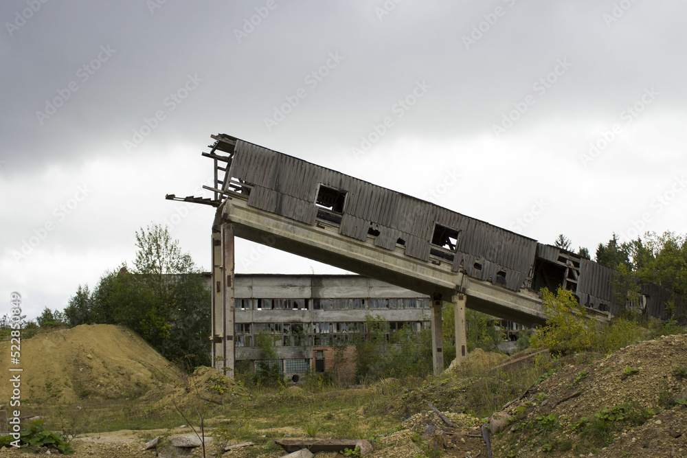 abandoned ruined building. concrete walls with broken windows and a ...