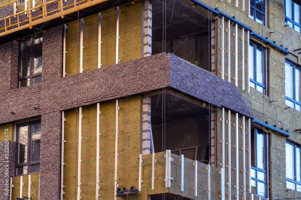 Monolithic concrete frame of apartment building under construction with ...