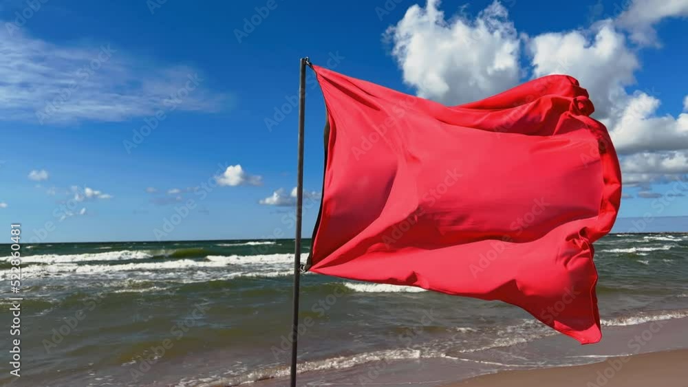 Danger: Red flag is warning about the prohibition of swimming on the ...